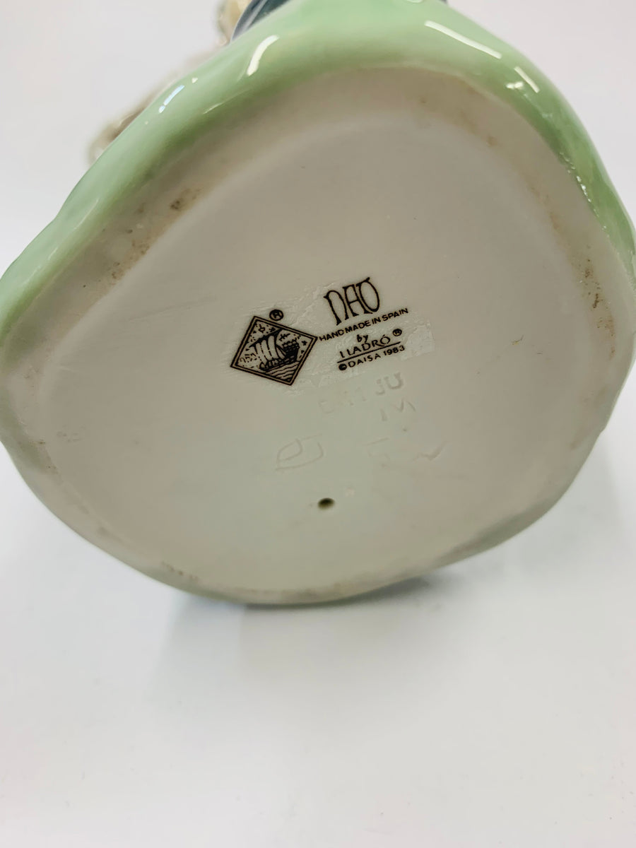 Nao boy with adoring puppy – Antique Alley